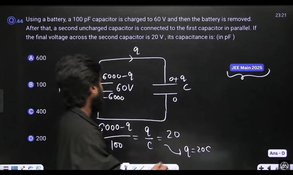 44 Using a battery, a 100 pF capacitor is charged to 60 V and then the ba..